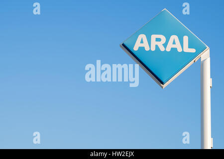 Aral sign against blue sky. Aral is a brand of automobile fuels and ...