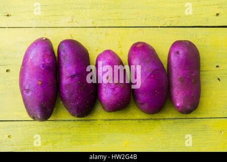 Five potatoes in a row Stock Photo - Alamy