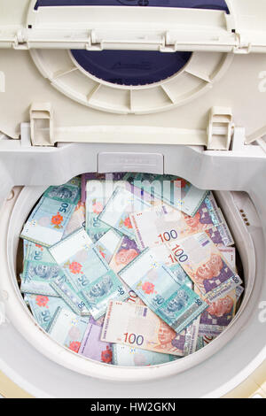 Money laundering concept with Ringgit Malaysia notes on clothesline in ...