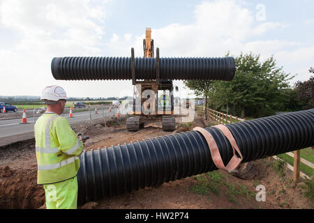 Drainage pipework being installed under a new section of the A5 near ...