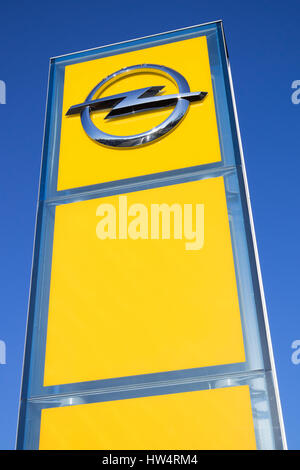 Opel logo sign at a car dealer building. Emblem on a yellow background ...