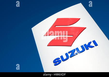 Suzuki dealership sign against blue sky Stock Photo - Alamy