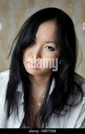 Close-up of beautiful asian woman looking happy, smiling cute at camera ...
