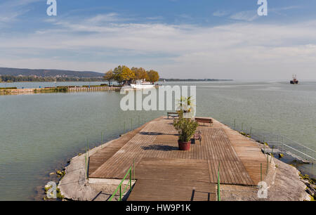 Tanning area with bench on bath island Szigetfurdo on the lake Balaton ...