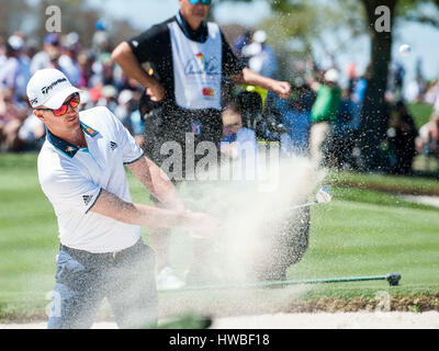 Justin Rose, of England, hits from the first fairway during the first ...