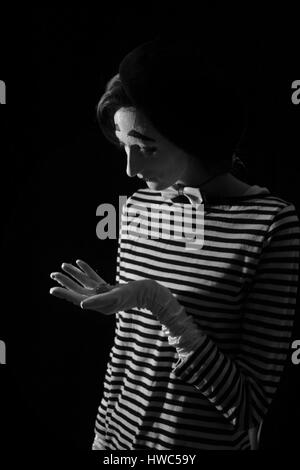 Emotional professional mime in stripped blacn and white shirt with ...