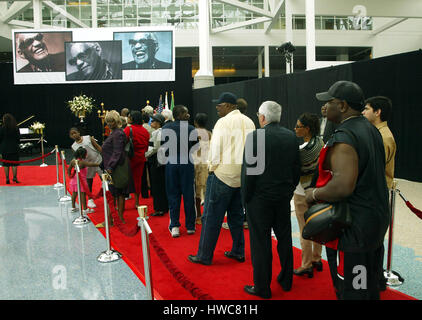 Mourners view the casket of singer Ray Charles at the Los Angeles ...