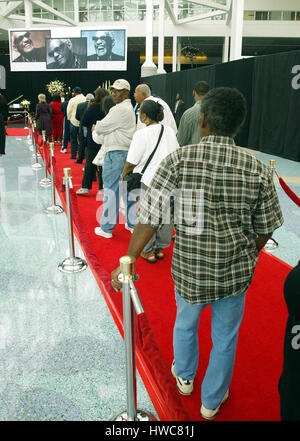 Mourners view the casket of singer Ray Charles at the Los Angeles ...