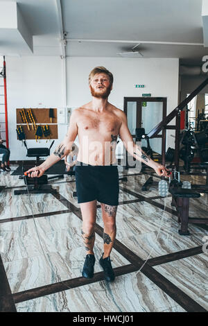 Rope man fitness gym beard training battle fit sport exercise, concept ...