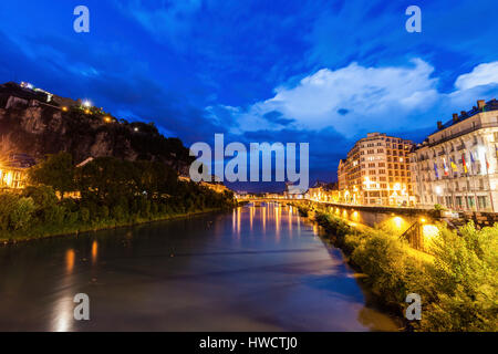 Grenoble architecture along Isere River seen at sunset. Grenoble ...