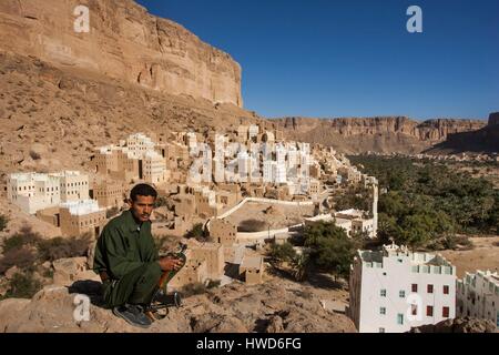 Yemen, clinging to the cliff, one of the many magnificent adobe ...