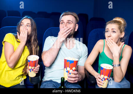 Audience in movie theater with shocked expressions Stock Photo - Alamy
