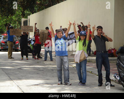 FILE - Protesters hold placards during a 'Sack ScoMo!' climate change ...