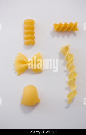 Raw lumache rigate pasta arranged on wooden surface Stock Photo - Alamy