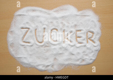 the German word Zucker, sugar, written in sugar Stock Photo - Alamy
