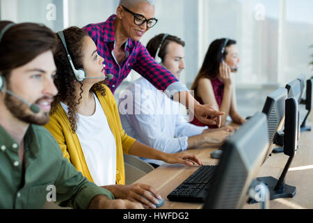 Male customer support executive assisting client though call. Holding ...