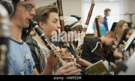 A teenage boy playing clarinet in school, UK Stock Photo - Alamy
