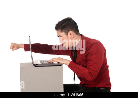 Angry business man punch laptop Stock Photo - Alamy