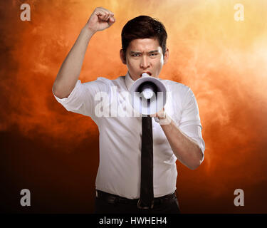 Asian business man talk loud using megaphone Stock Photo - Alamy