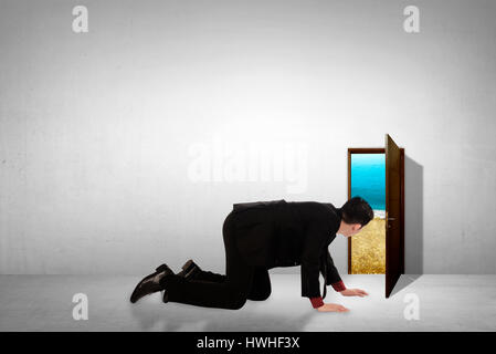 Business man take peek on small door through beach. Vacation ...