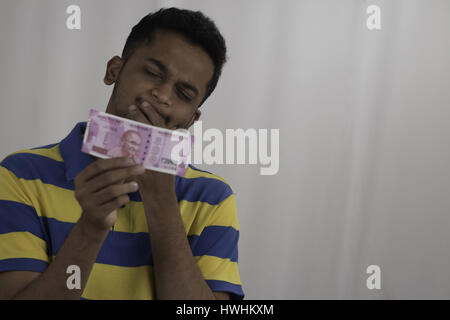 Indian man counting newly launched indian five hundred rupees. Money ...