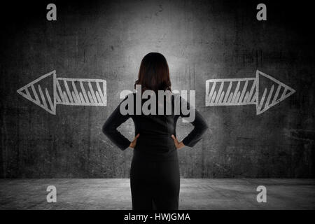 Business person choosing between two options separated by a yellow ...