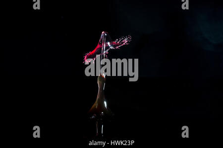 Images forming two drops of water when colliding after falling in water ...