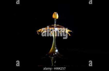 Images forming two drops of water when colliding after falling in water ...