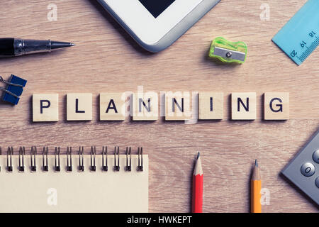 Elements of game with letters spelling business keywords on workplace ...