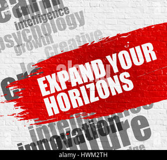 Expand Your Horizons on White Brick Wall Stock Photo - Alamy