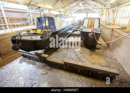 pair of narrowboats in dry dock for blacking Stock Photo - Alamy
