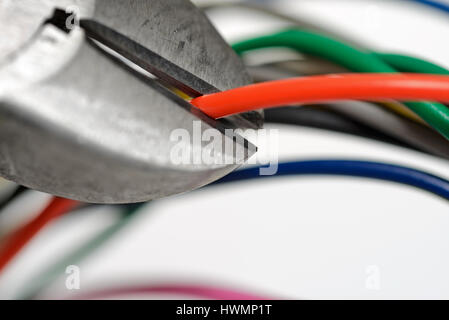 Pliers in red and black colored on a black background with blank text ...