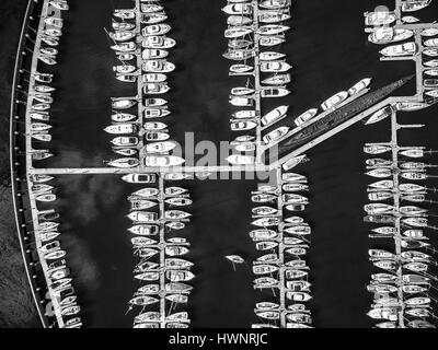 Looking straight down at moored sailboats and old decommissioned ...