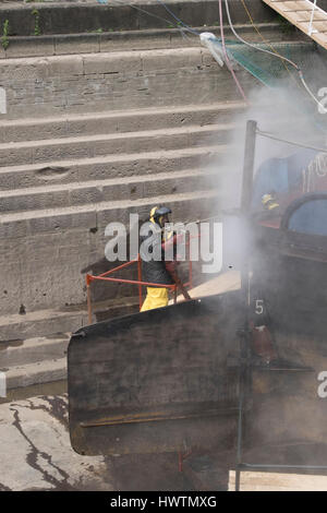 Cleaning the hull of unpowered barge Sabrina 5 in Gloucester drydock ...