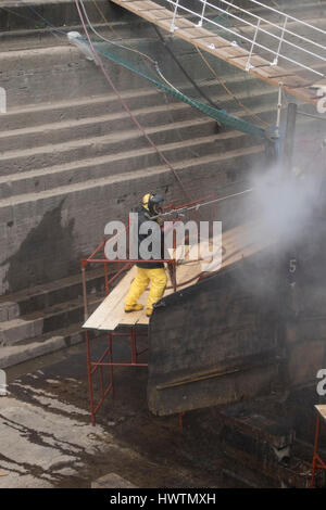 Cleaning the hull of unpowered barge Sabrina 5 in Gloucester drydock ...