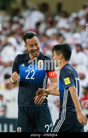 Maya Yoshida (C) of Japan scores during the second half of a Group B ...
