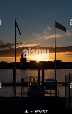 Cardiff, UK. 23rd March 2017. A golden sunset sets over Cardiff Bay ...