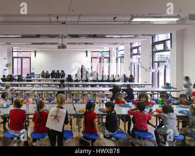 Interior view of a new school dining hall. Shows tables and chairs ...