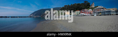 The coastline of Moneglia with the village on the sandy beach, in ...
