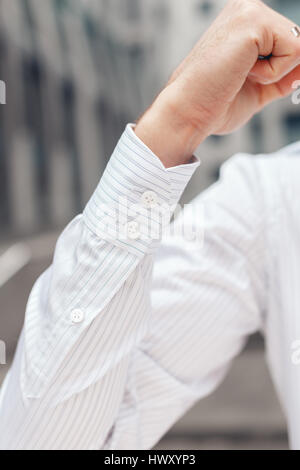 Close up of a businessman's shirt cuffs Stock Photo - Alamy