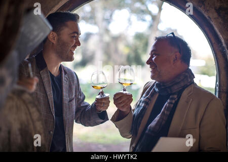 People in distillery tasing whiskey Stock Photo - Alamy