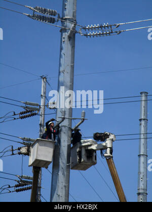 In this May 6, 2013 photo, a Filipino fisherman climbs up the Queen Kim ...