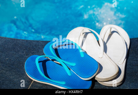 Slippers near swimming pool Stock Photo - Alamy