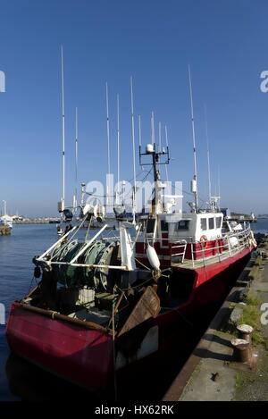 Details of trawler cable warp pulley and fishing net on the stern of a ...
