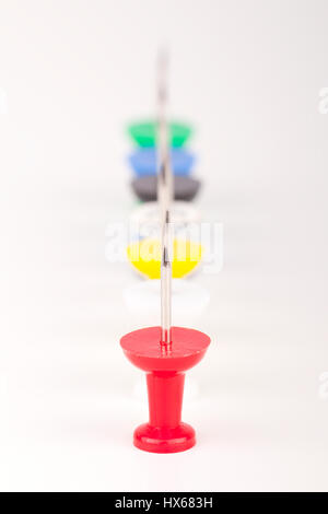 colorful pushpins on white background Stock Photo - Alamy