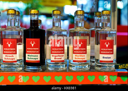Bottles with schnapps for sale in the indoor market, Innsbruck, Austria ...