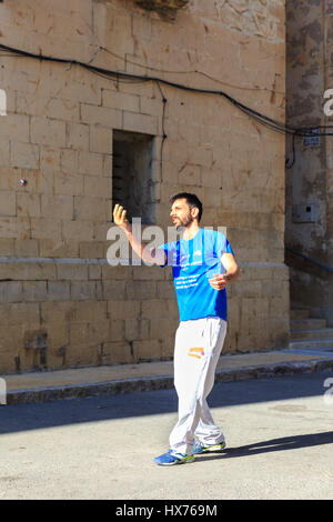 A player participates in the traditional game of Pilota Valenciana, in ...
