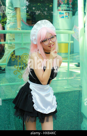Bangkok - Dec 28: An unidentified Japanese anime cosplay pose in COSCOM ...