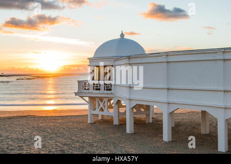 Romantic sunset at Cadiz beach with famous pier Stock Photo - Alamy