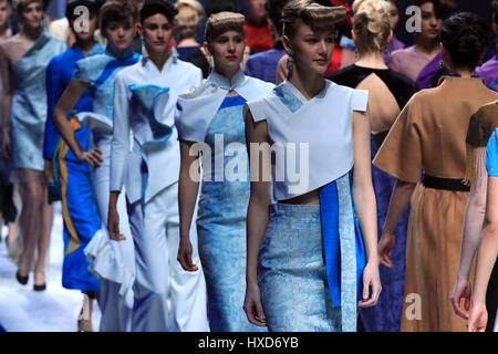 Beijing, China. 28th Mar, 2017. Models present creations designed by ...